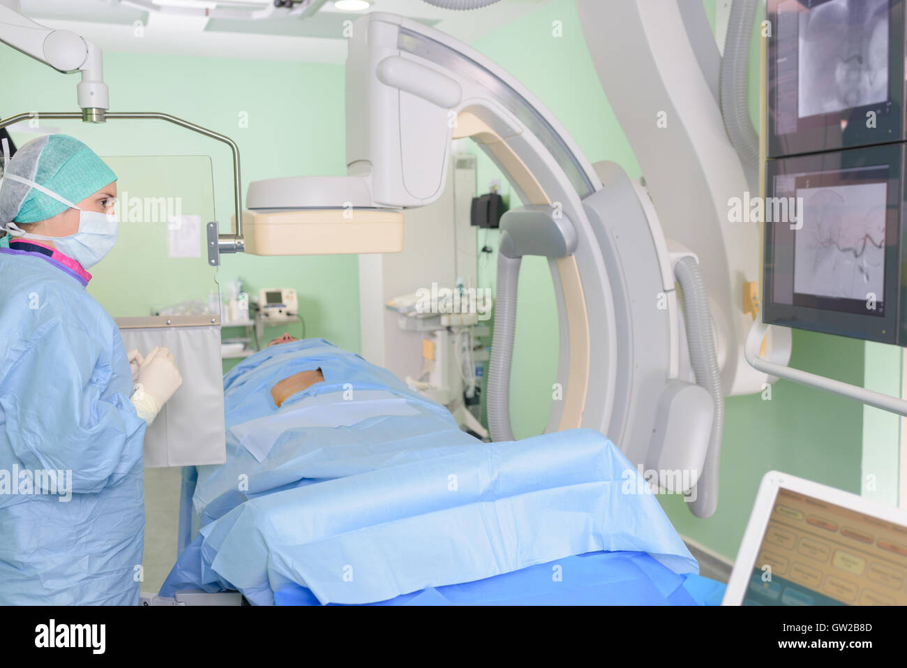 Nurse observing patient in theatre Stock Photo - Alamy