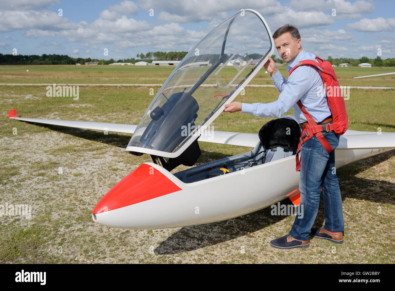 Man about to get into glider Stock Photo - Alamy