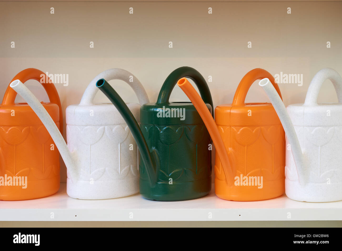 Watering plants with cans hi-res stock photography and images - Alamy