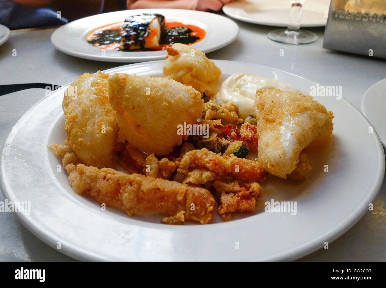 Tapas of fried Calamares, fried squid and fried red peppers, Spain ...