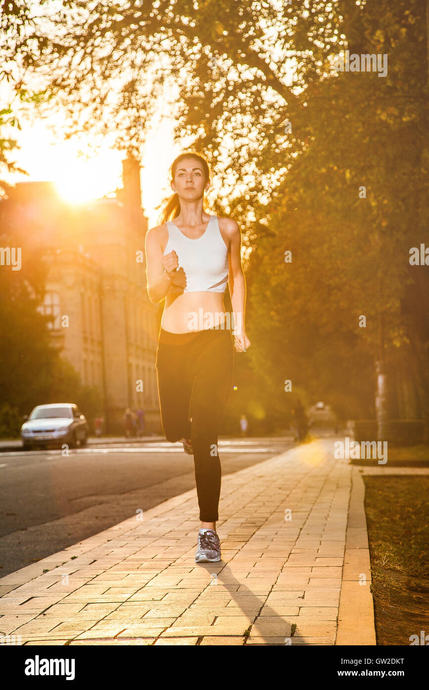 young beautiful happy and sexy runner girl with nice body in the ...