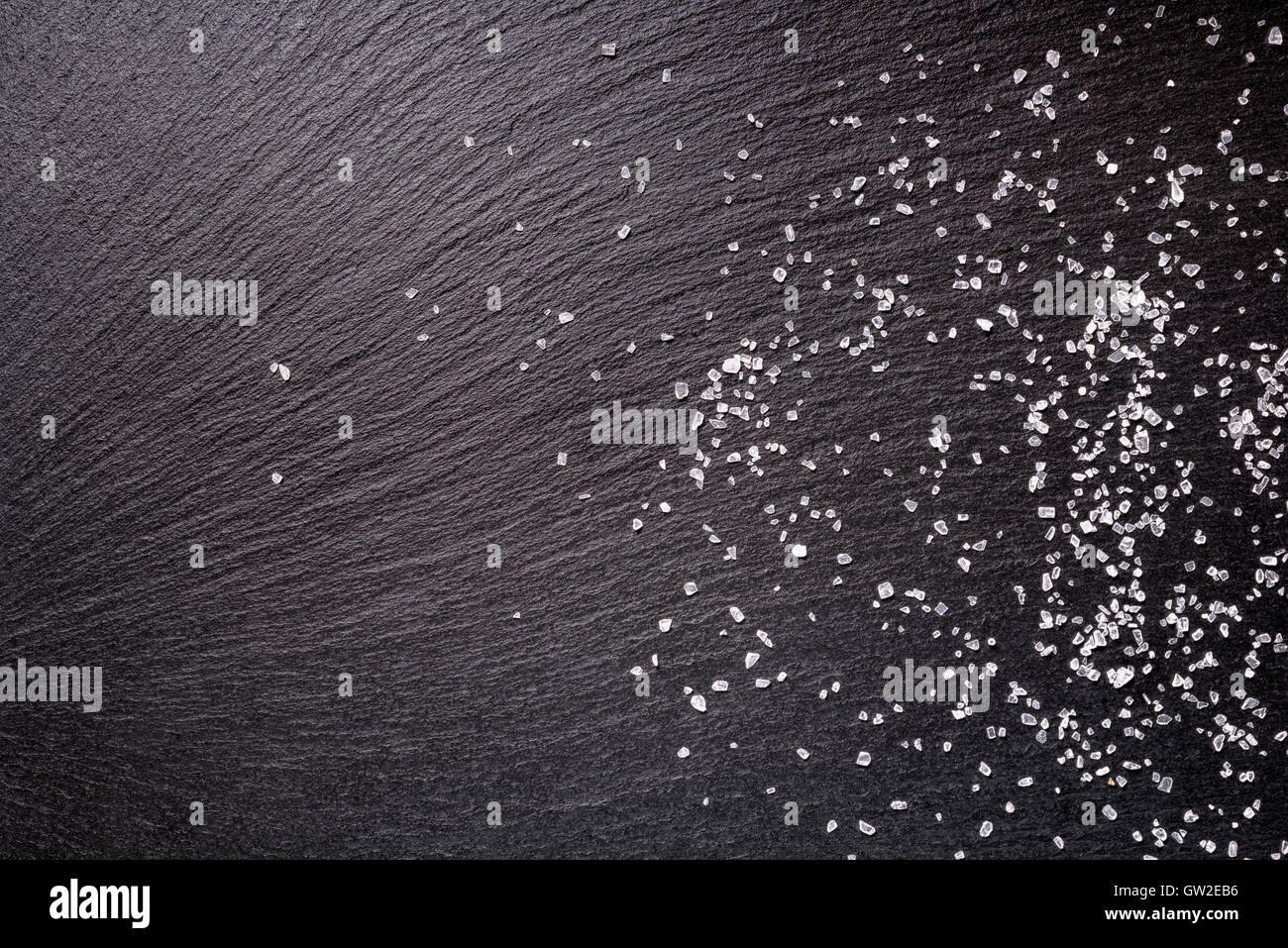sprinkled sea salt over black slate stone background, top view Stock ...