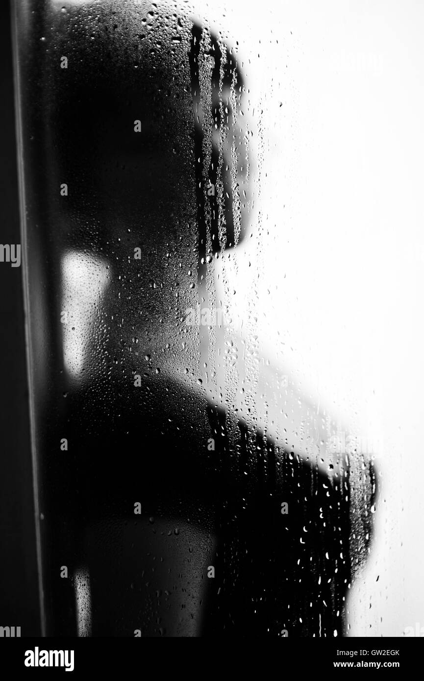 Image of a woman in a sweaty window Stock Photo - Alamy