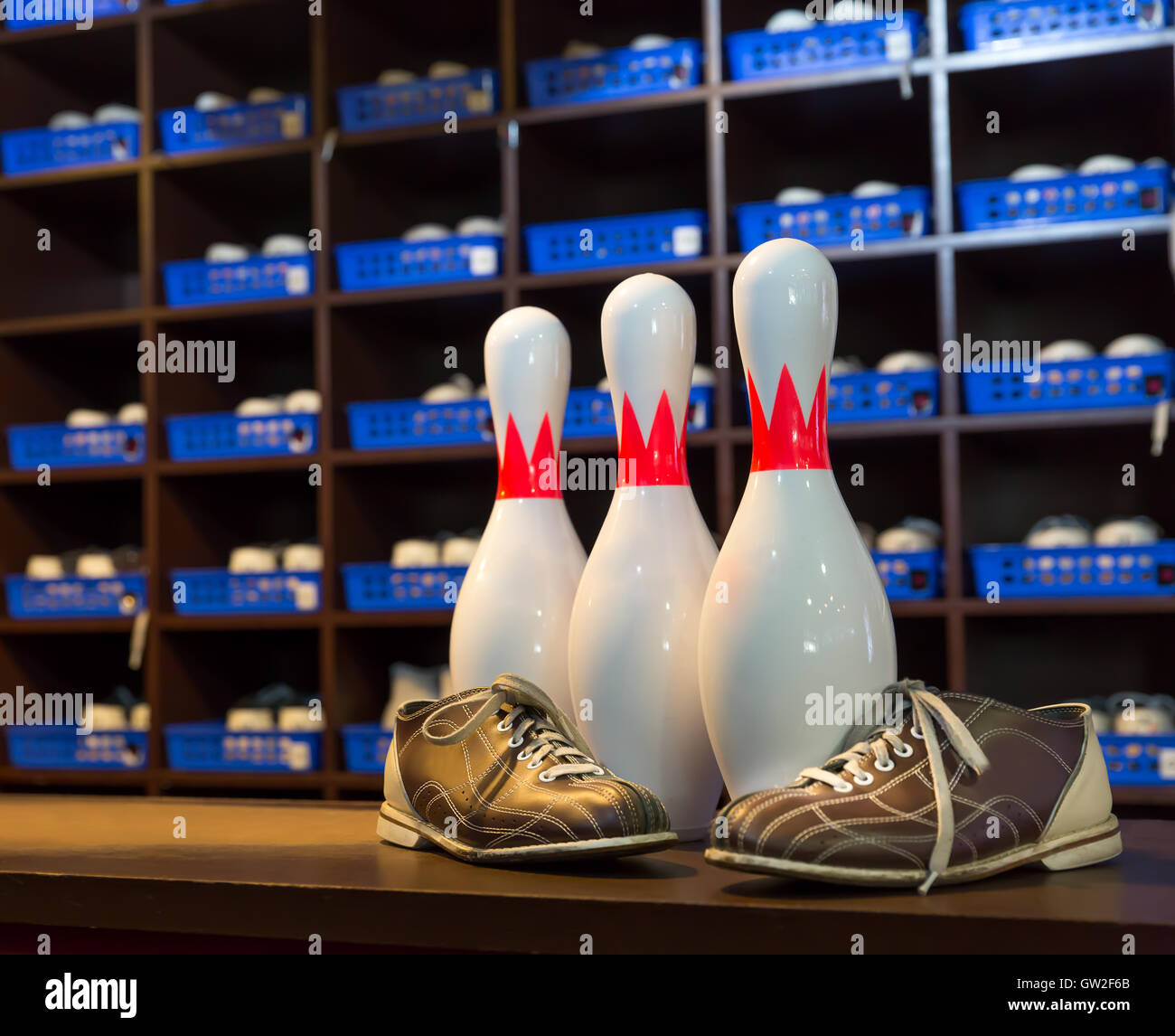 Bowling shoes and pins Stock Photo - Alamy