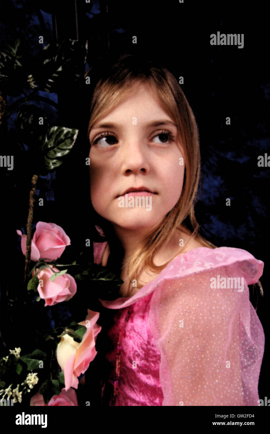Girl beside rose trellis Stock Photo - Alamy