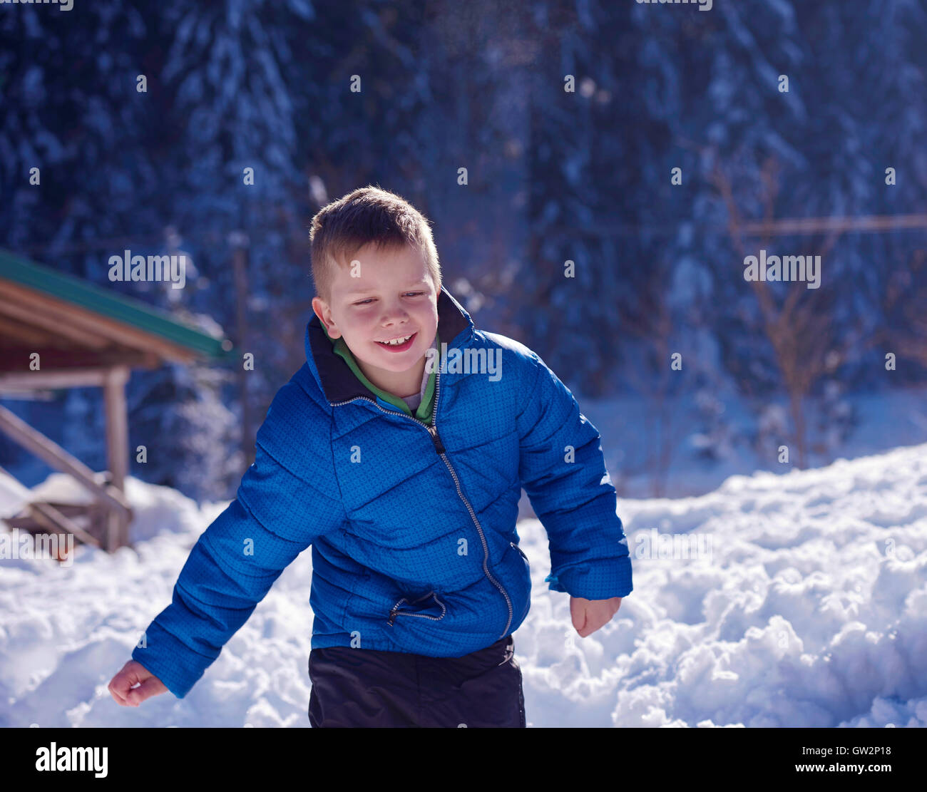 happy kids playing in fresh snow at beautiful sunny winter day Stock ...