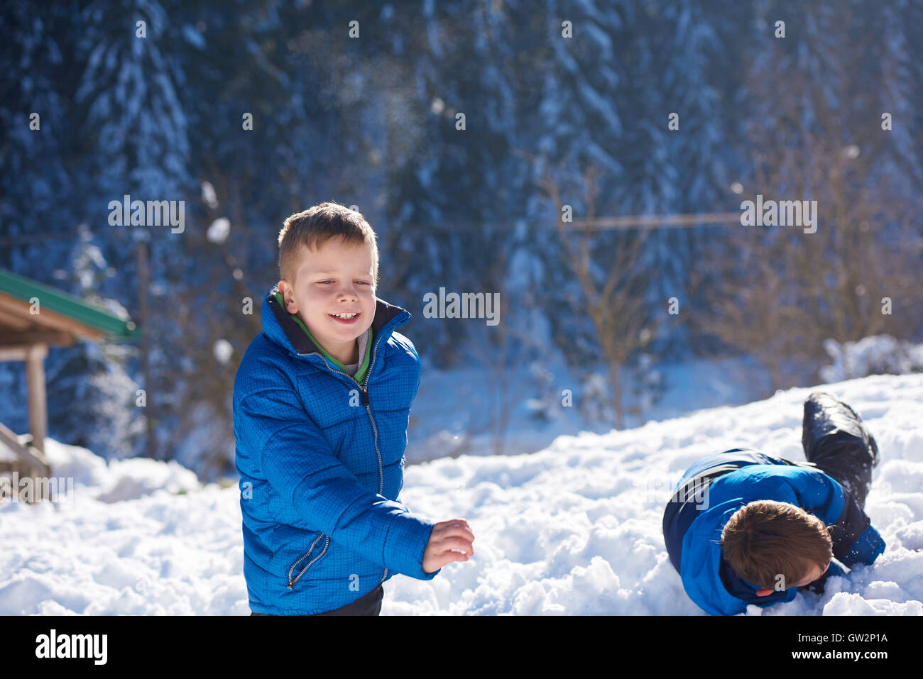 happy kids playing in fresh snow at beautiful sunny winter day Stock ...