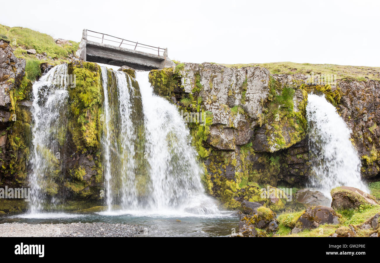 Kirkjufellsfoss waterfall near the Kirkjufell mountain on the north ...