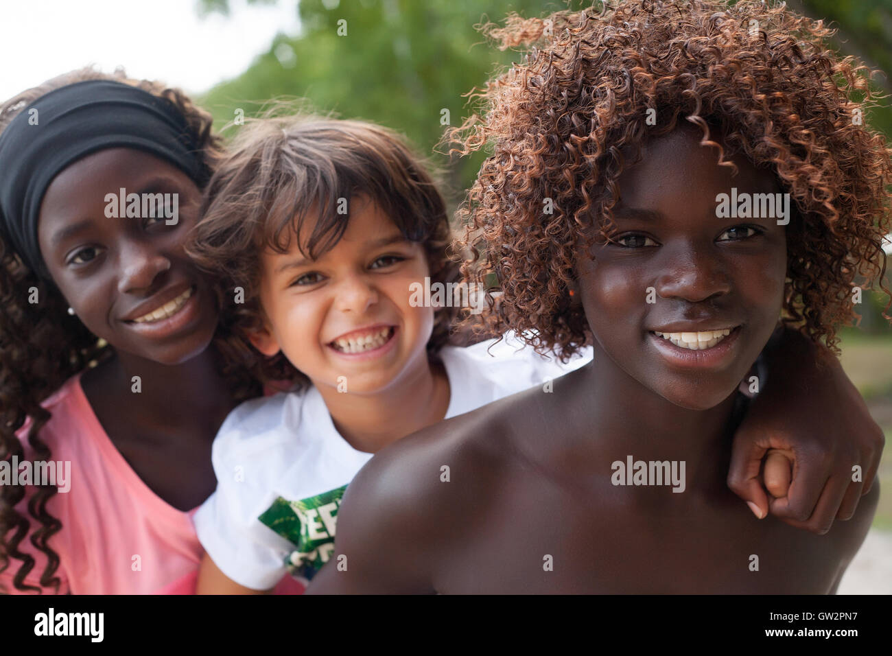 Happy ethnic children Stock Photo - Alamy
