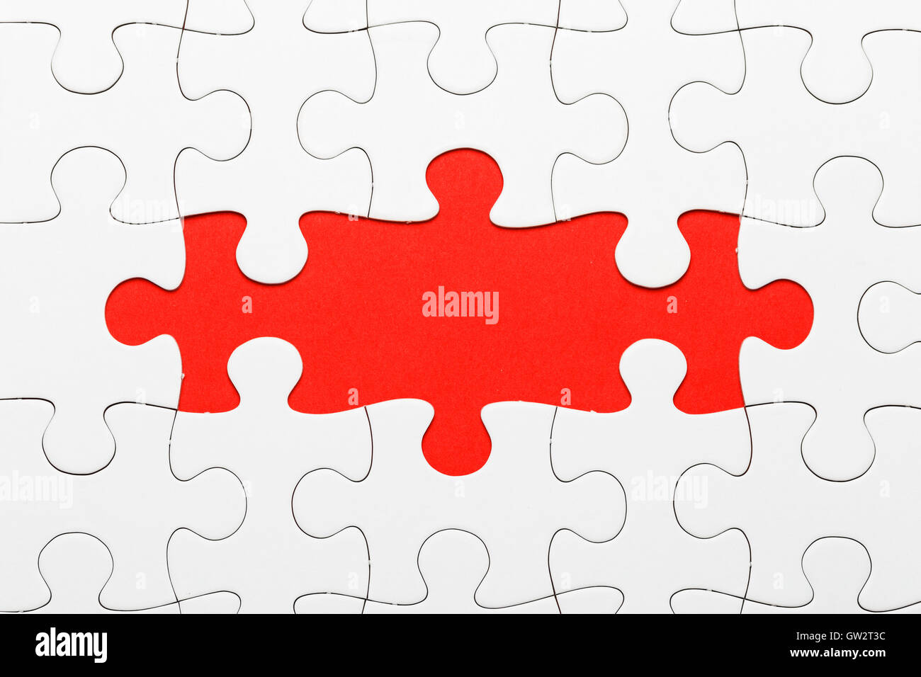 Incomplete puzzle in red color Stock Photo - Alamy