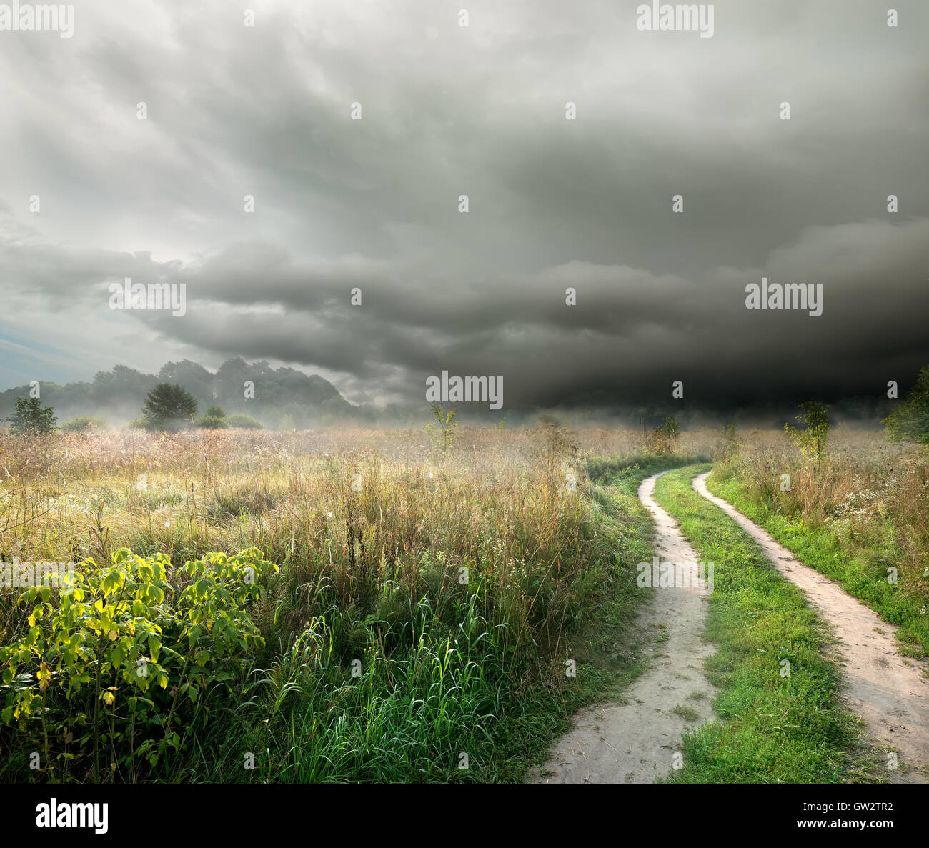 Storm clouds and road Stock Photo - Alamy