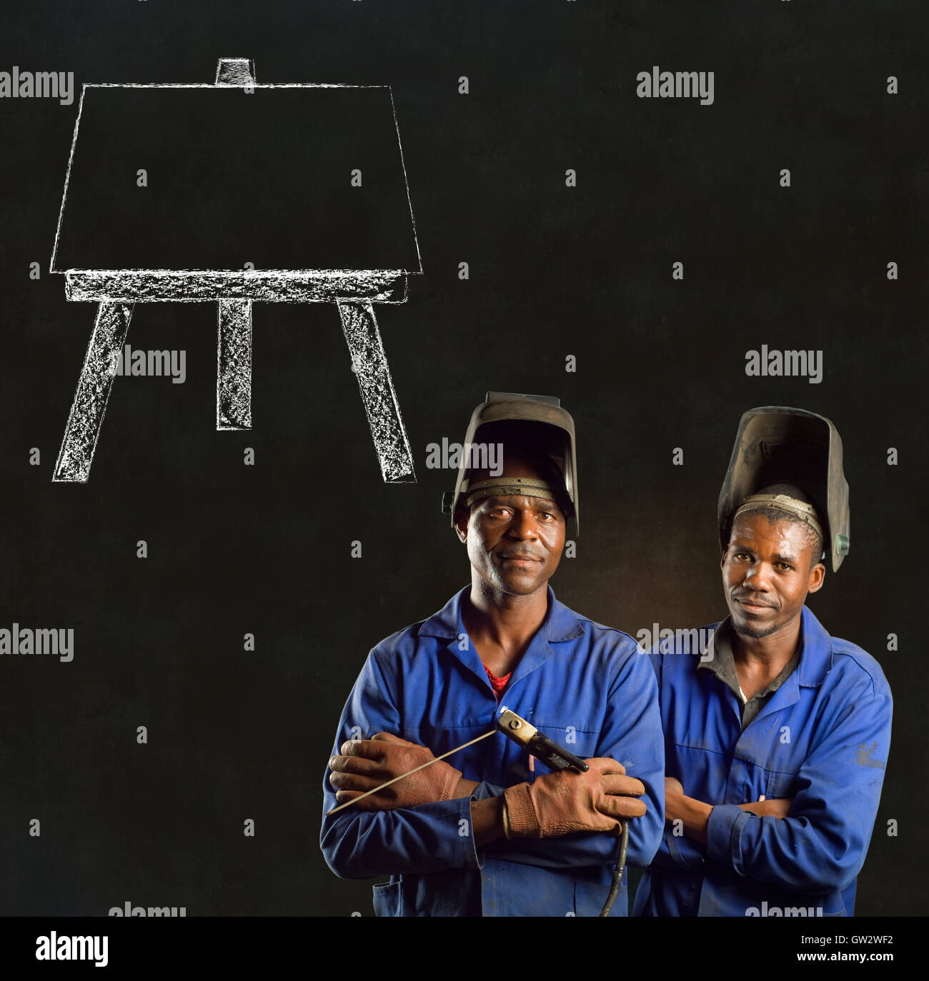 African black man industrial worker with chalk easel on blackboard ...