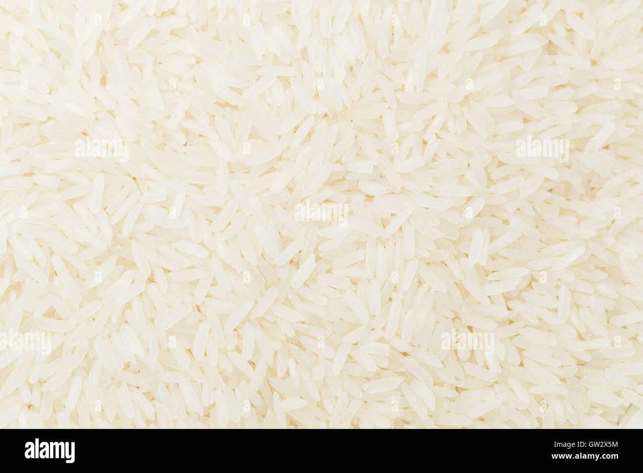 Uncooked white rice Stock Photo - Alamy