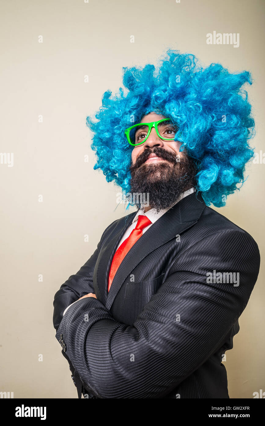 crazy funny bearded man with blue wig Stock Photo - Alamy