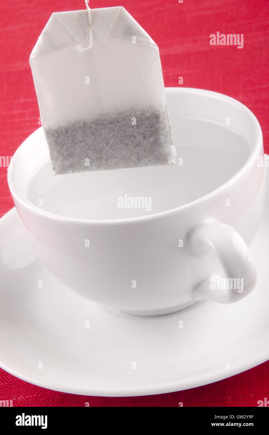 tea cup and a fresh tea bag Stock Photo - Alamy