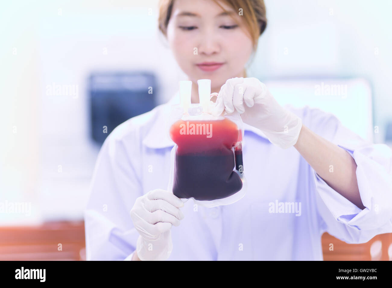 Bag of Blood in hand asian woman Doctor Stock Photo - Alamy