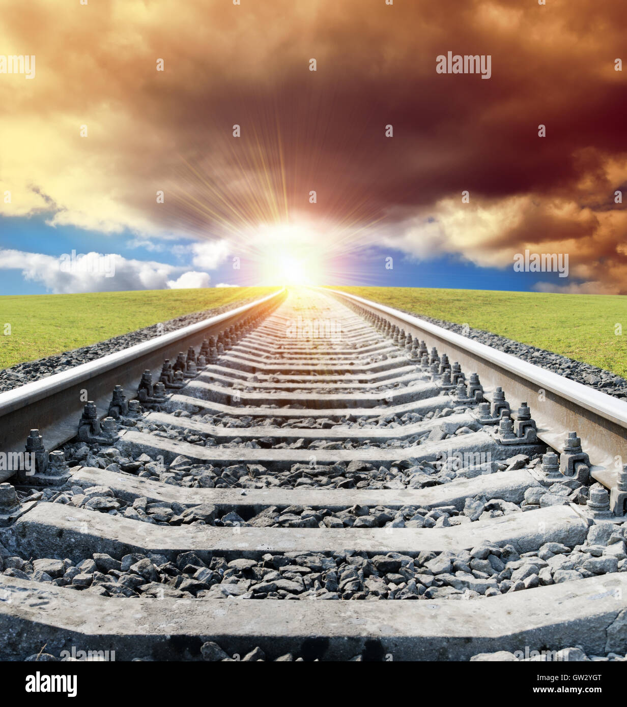 rail to sun in dramatic sky Stock Photo - Alamy