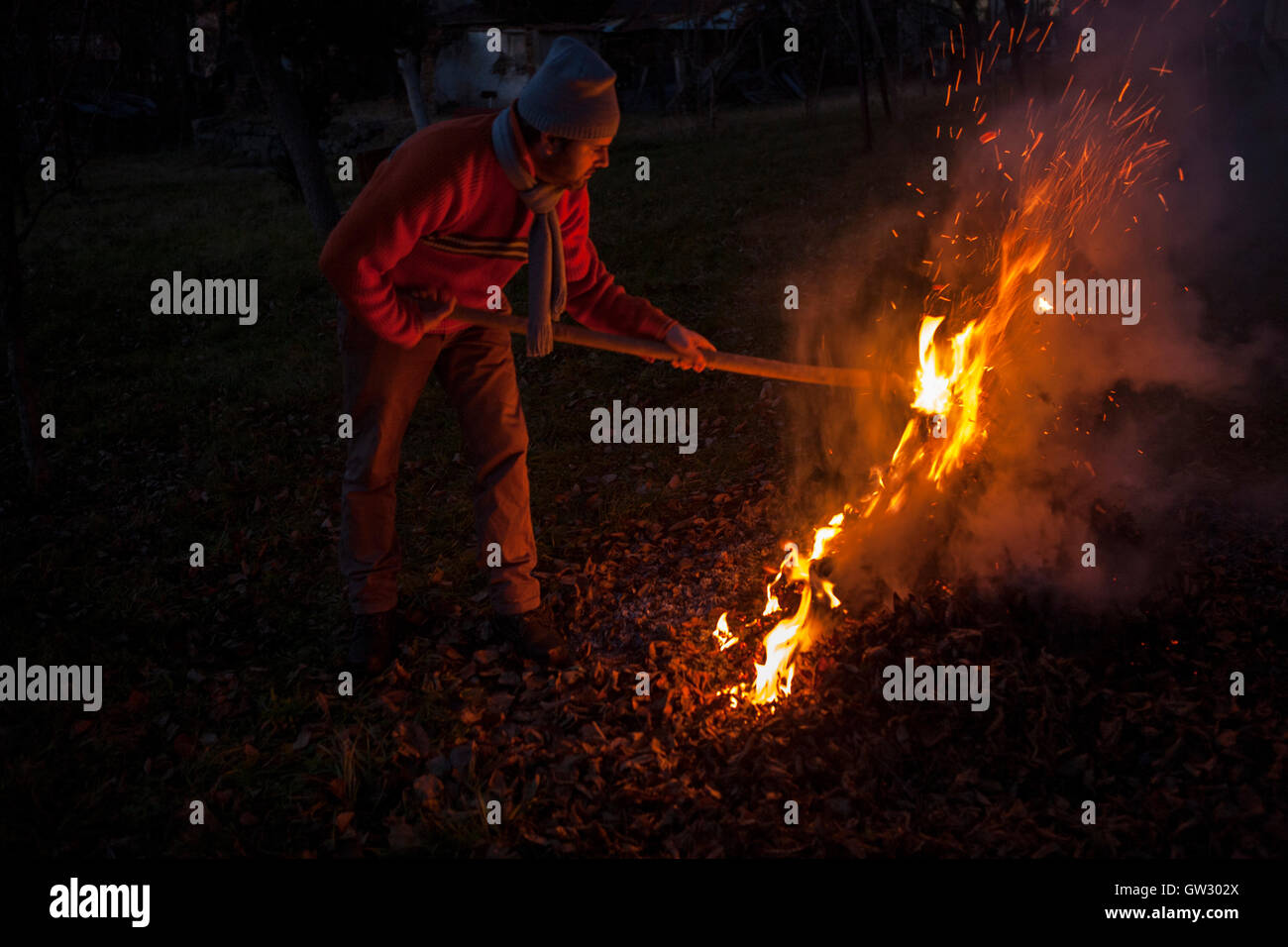 Bonfire, a man is burning in backyard Stock Photo - Alamy