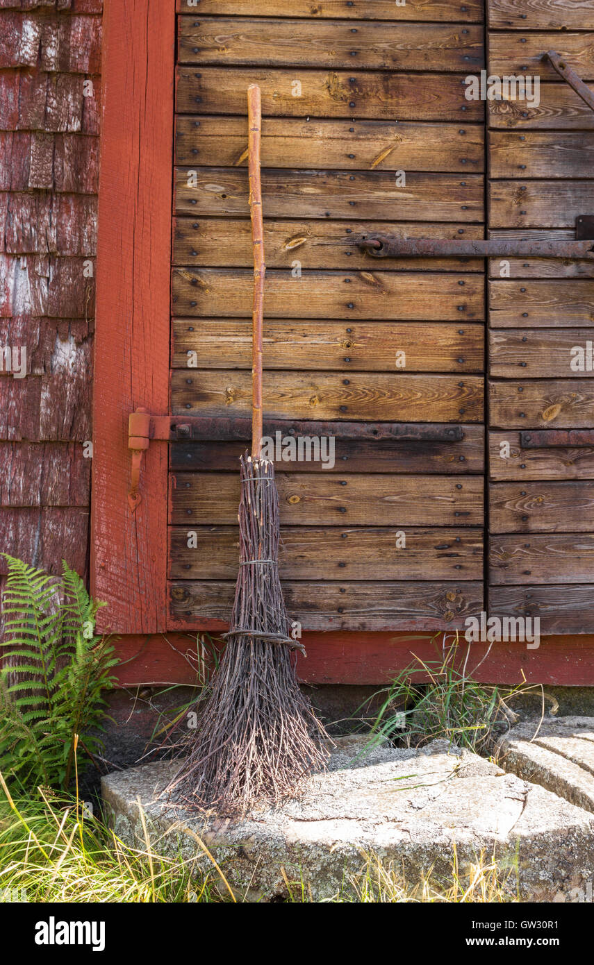 Broom at the entrance of a rustic house Stock Photo - Alamy