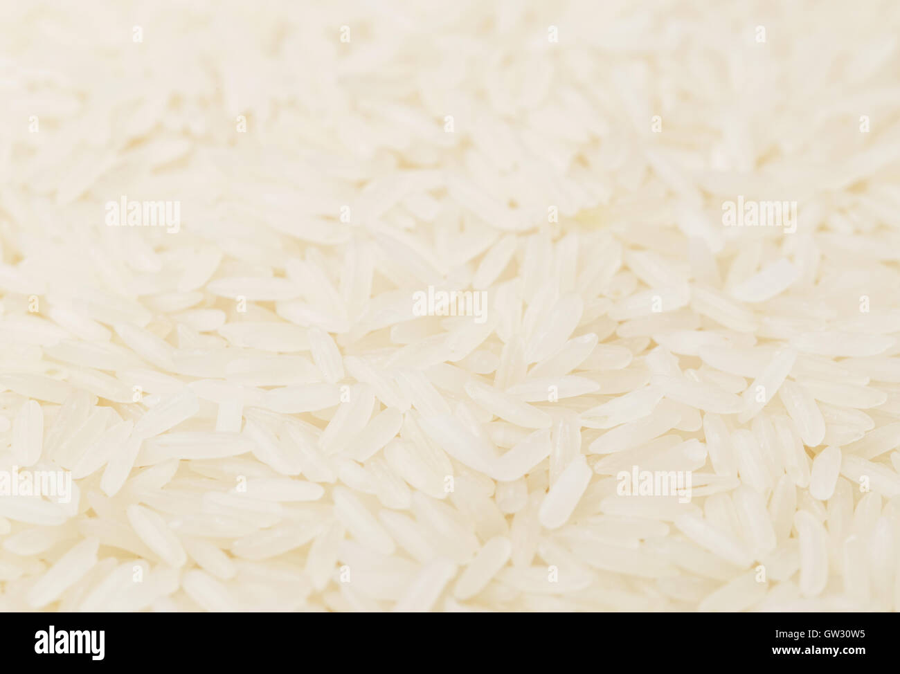 Uncooked white rice Stock Photo - Alamy