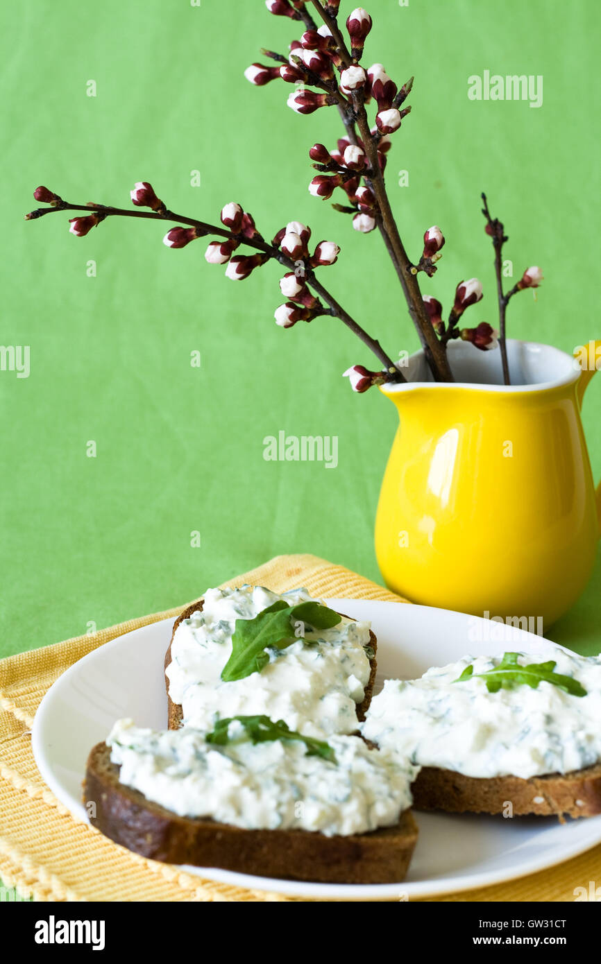 Cheese snack on rye bread and a bouquet Stock Photo - Alamy