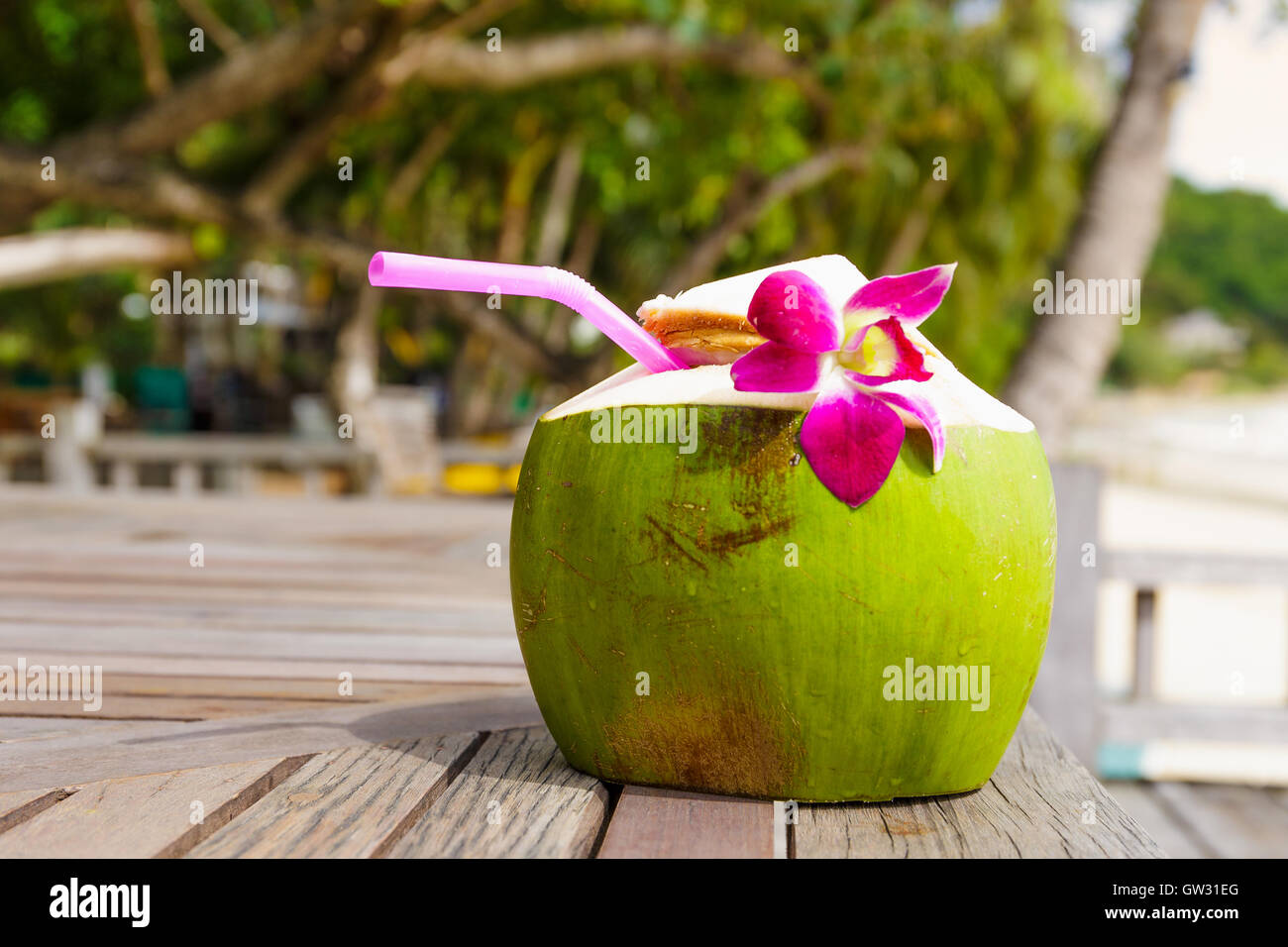 Coconut drink on the wooden table Stock Photo - Alamy