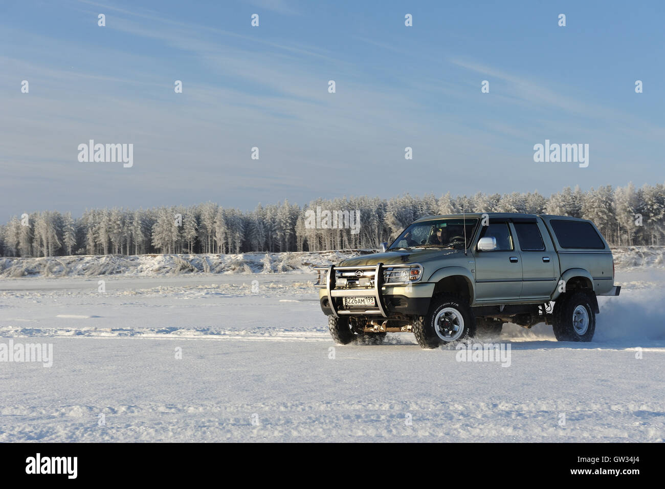 Great Wall Deer pickup driving on snowy river beach Stock Photo - Alamy