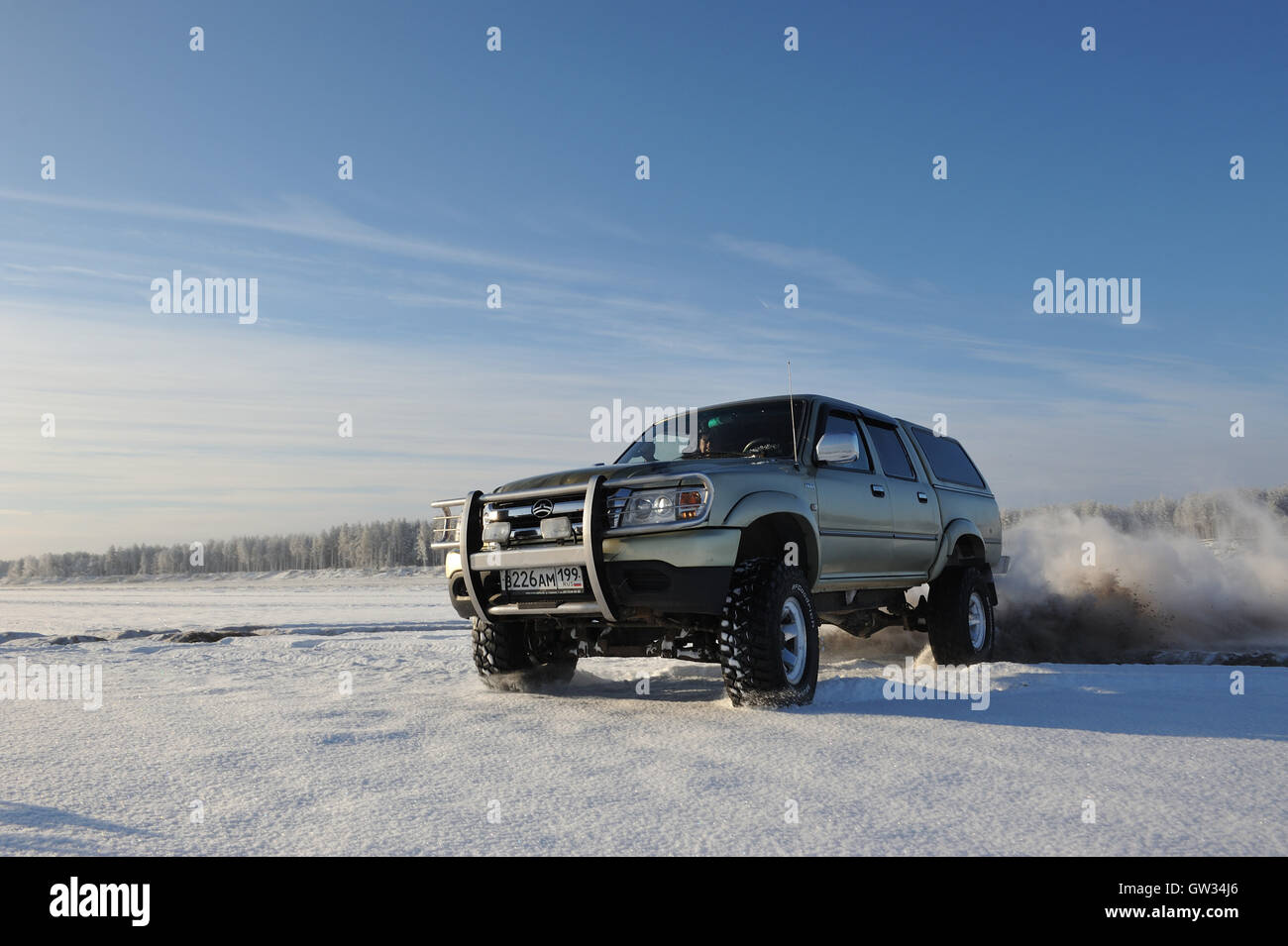 Great Wall Deer pickup driving on snowy river beach Stock Photo - Alamy