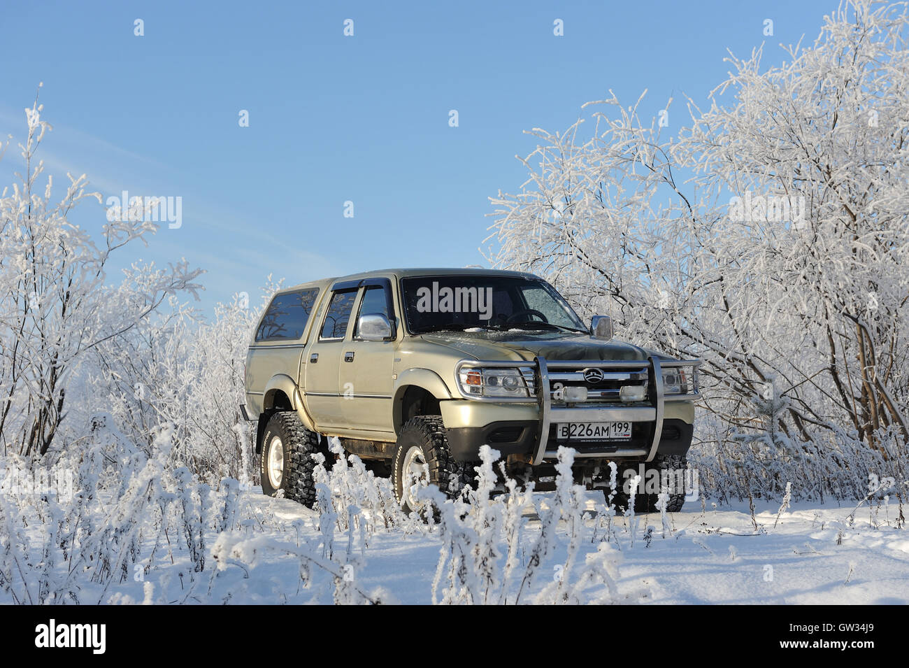 Great Wall Deer pickup driving on snowy area Stock Photo - Alamy