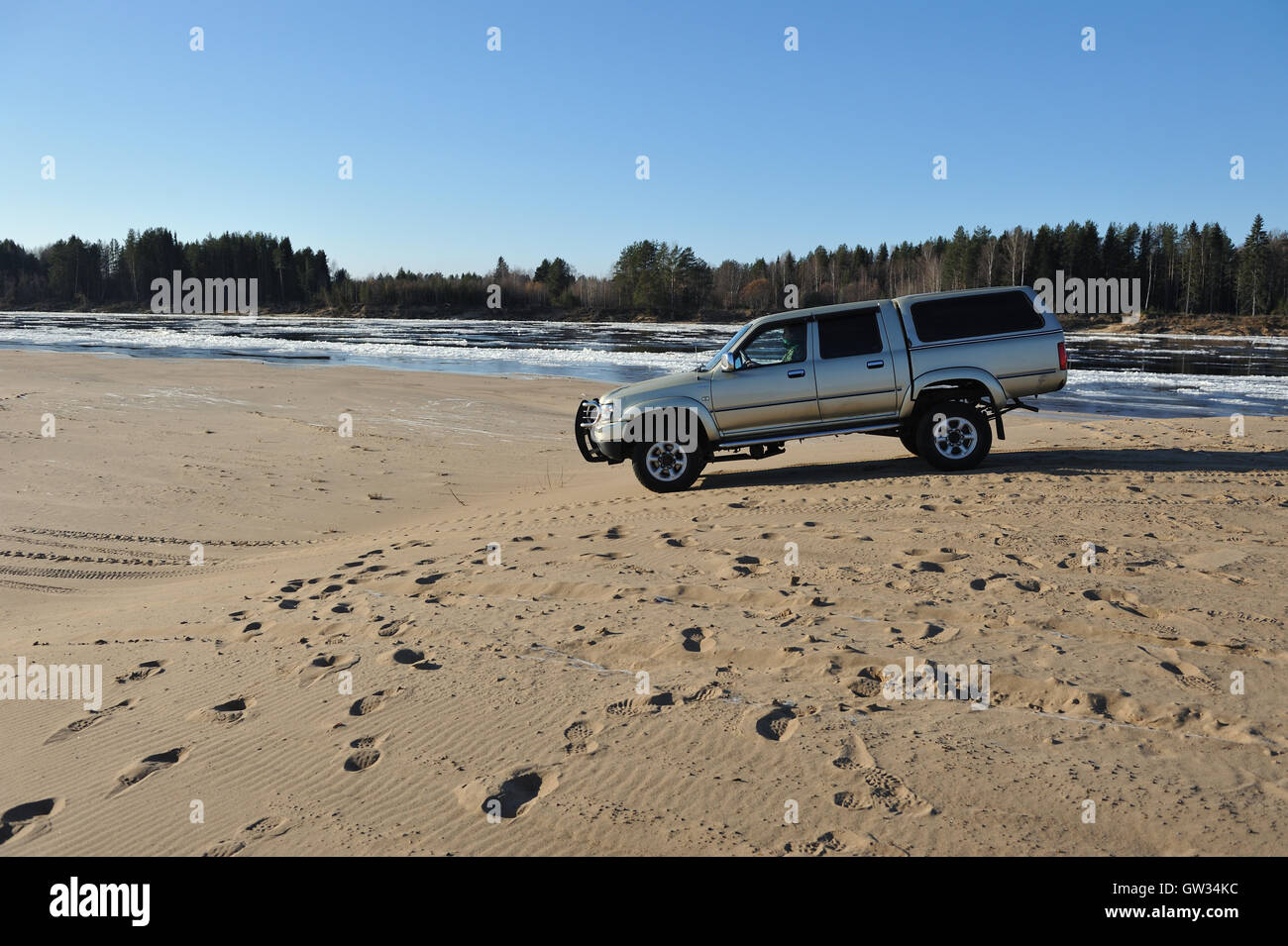 Great wall deer pickup on sandy beach of river Stock Photo - Alamy