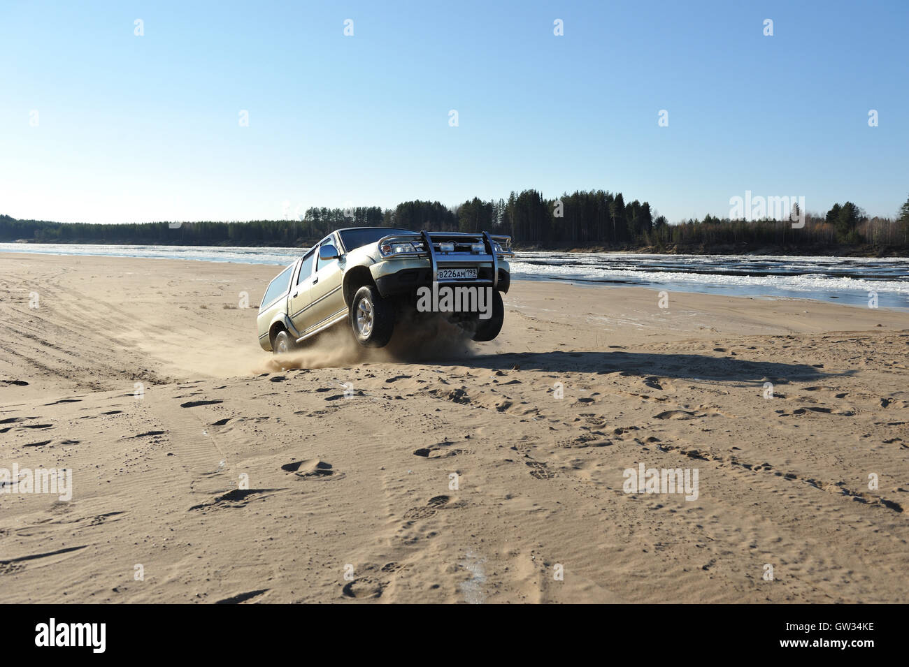 Great wall deer pickup on sandy river beach in flight Stock Photo - Alamy