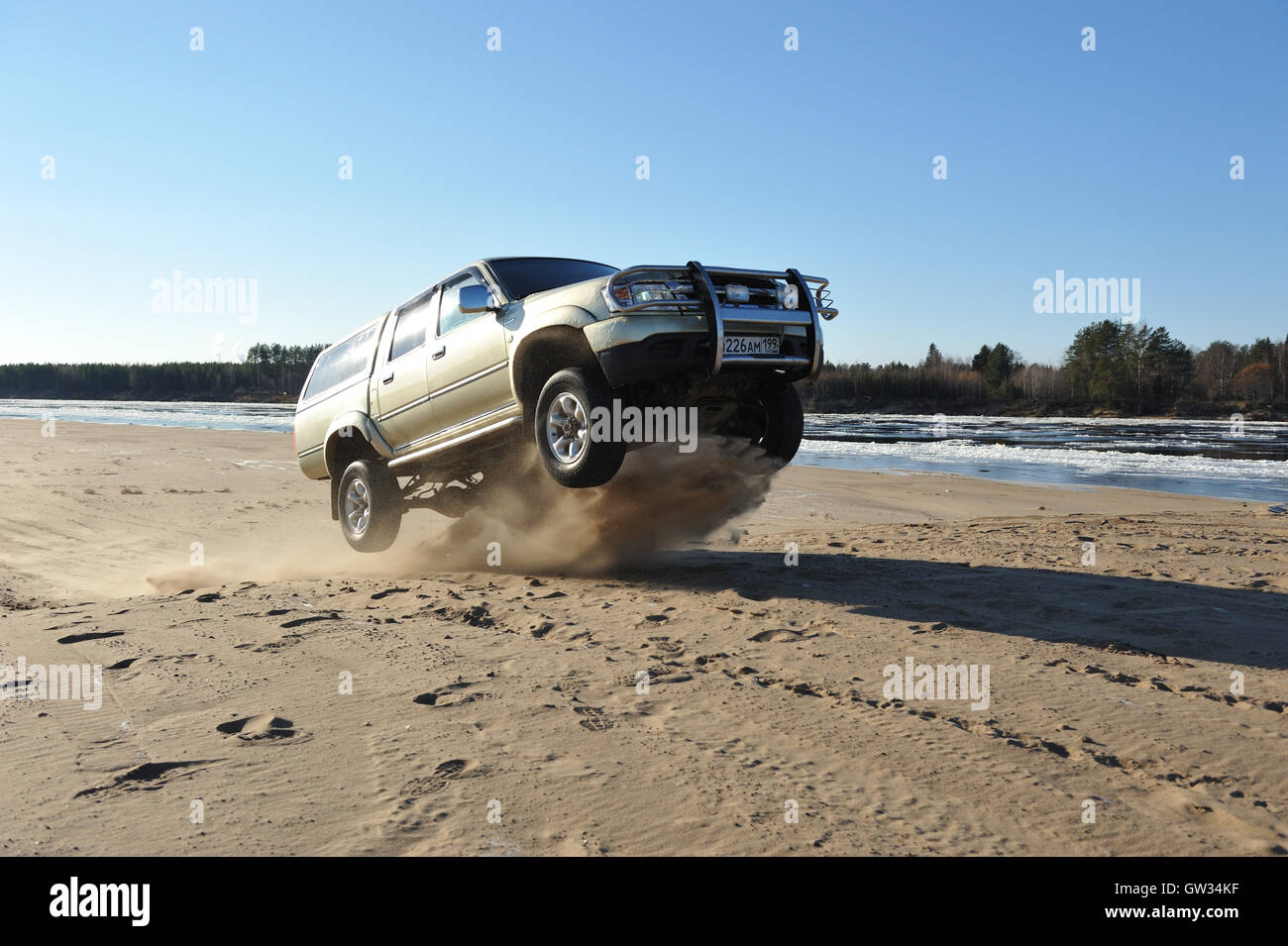 Great wall deer pickup on sandy river beach in flight Stock Photo - Alamy