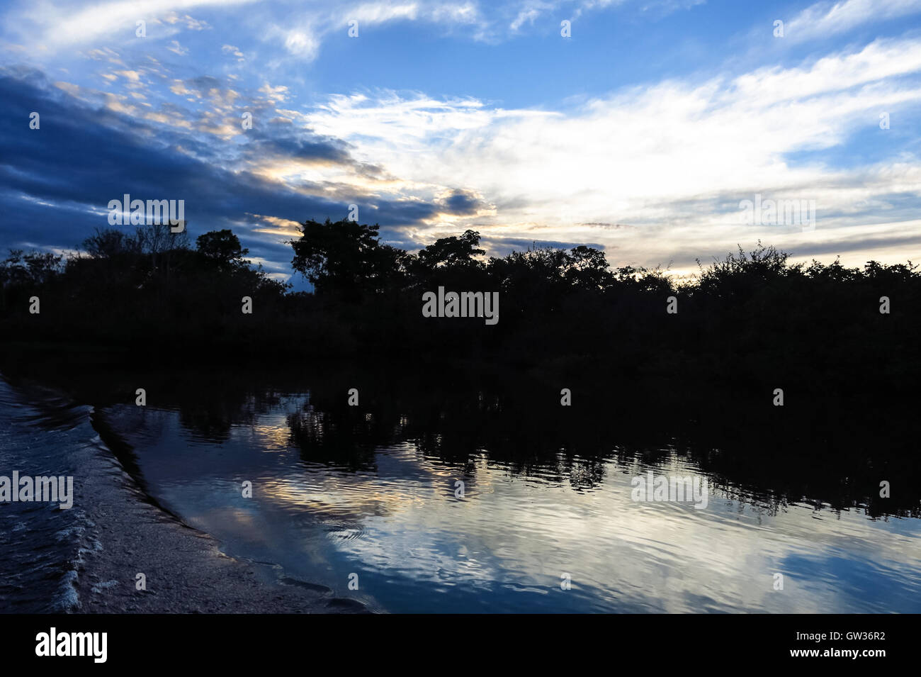 Sunset. Boat Crossing the Amazon. Beni region, Pampas de Yacuma ...