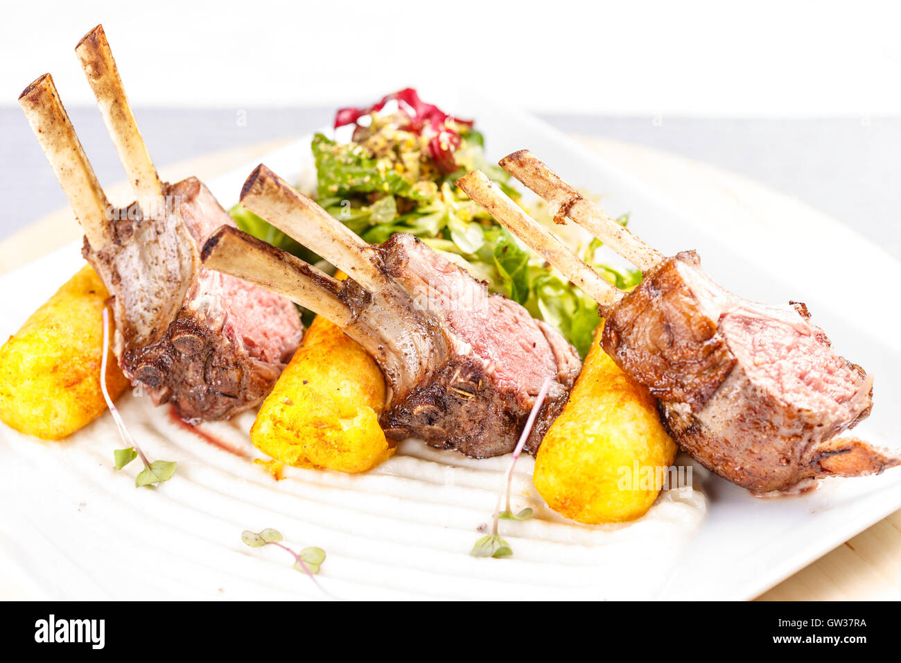 Plated meals awaiting service, fine dining Stock Photo - Alamy