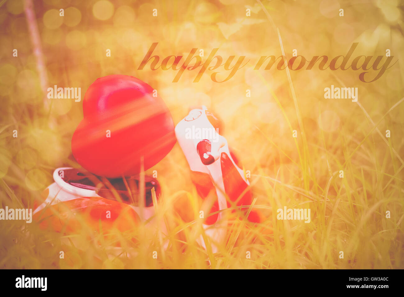 Happy Monday message with a miniature motorcycle carrying a heart ...