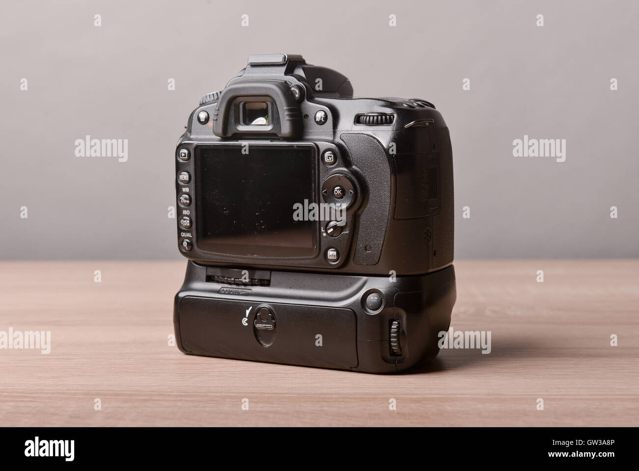 Digital photo camera on wooden desk table Stock Photo - Alamy