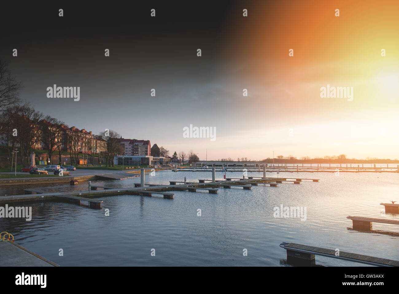 Yacht port over beautiful orange sunset in summer time Stock Photo - Alamy