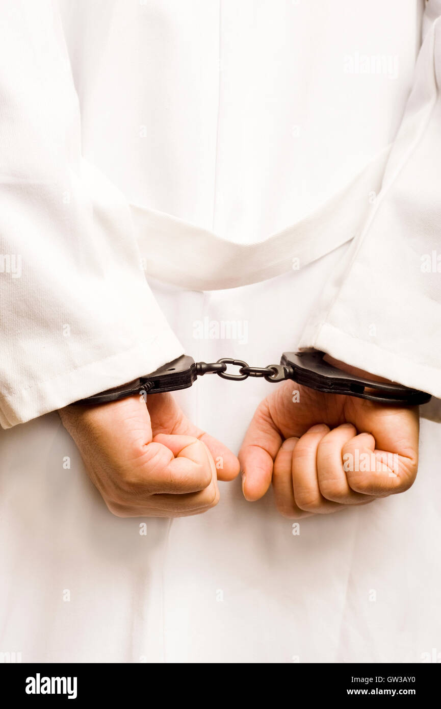 doctor in handcuffs Stock Photo - Alamy