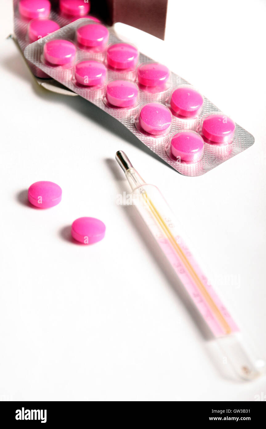 pills and thermometer Stock Photo - Alamy