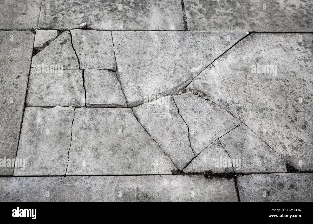 Cracked and broken concrete pavement slab Stock Photo - Alamy