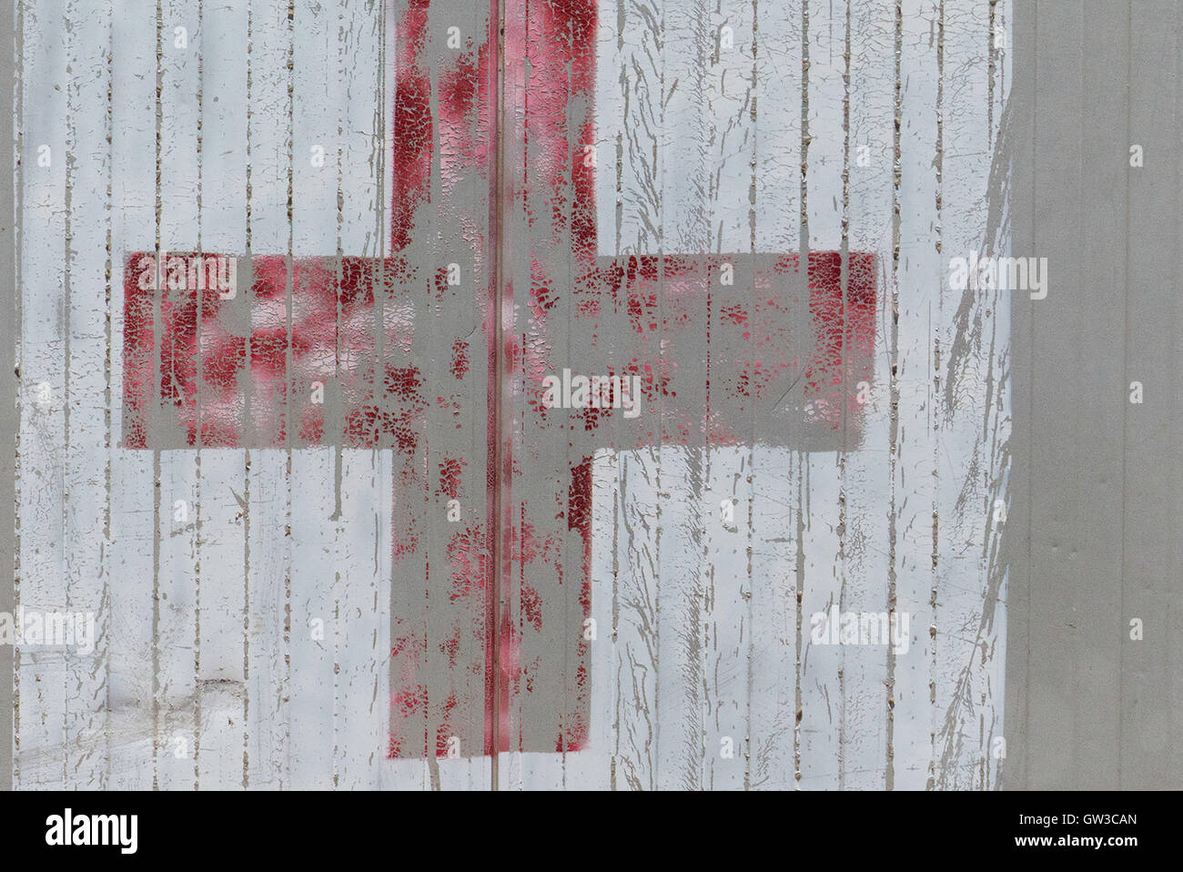 red cross symbol on side of house,old sign Stock Photo - Alamy