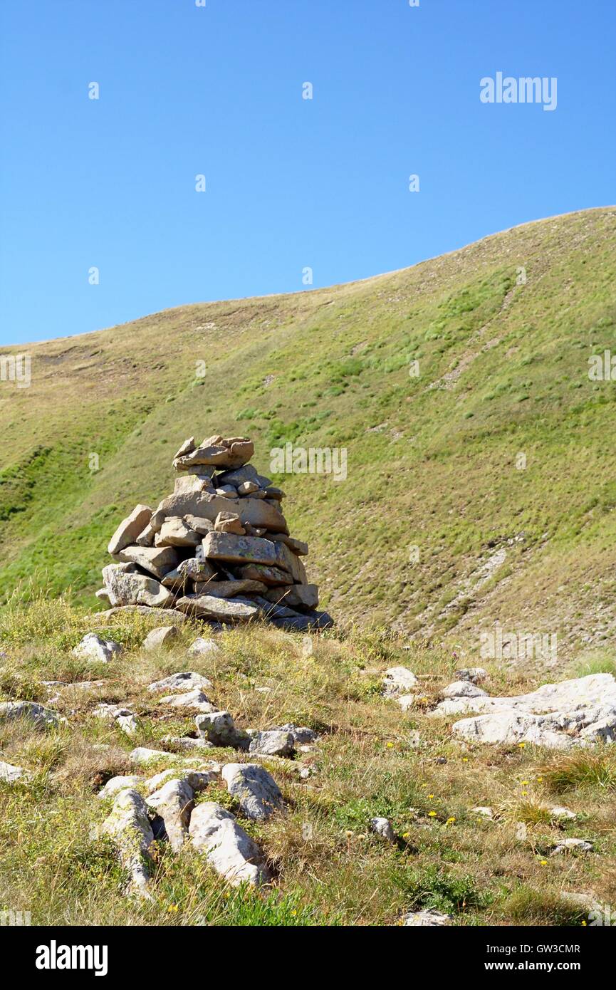 Hiking cairn marking a trail in mountain Stock Photo - Alamy