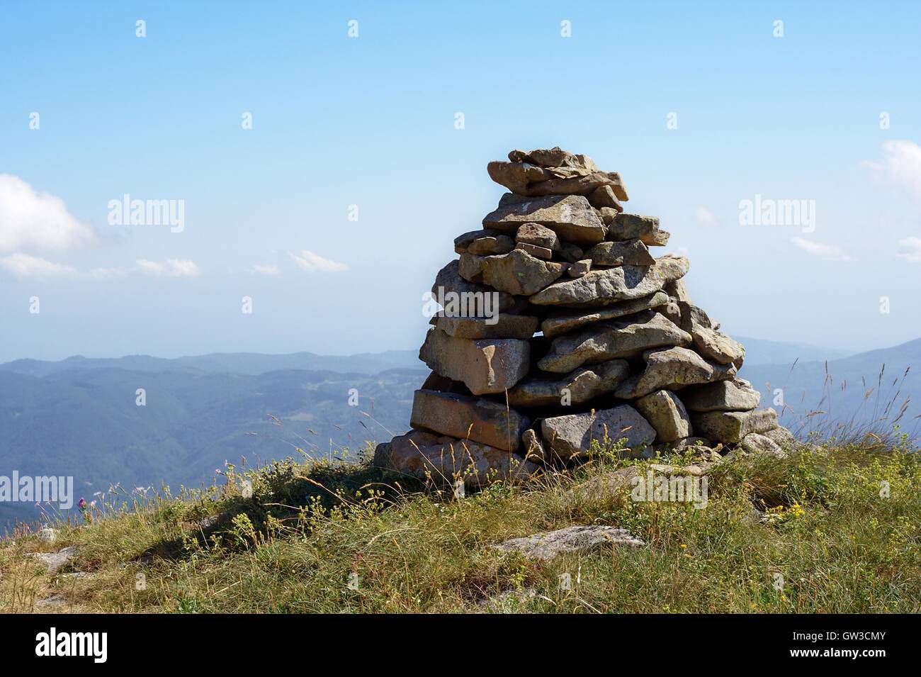 Hiking cairn marking a trail in mountain Stock Photo - Alamy
