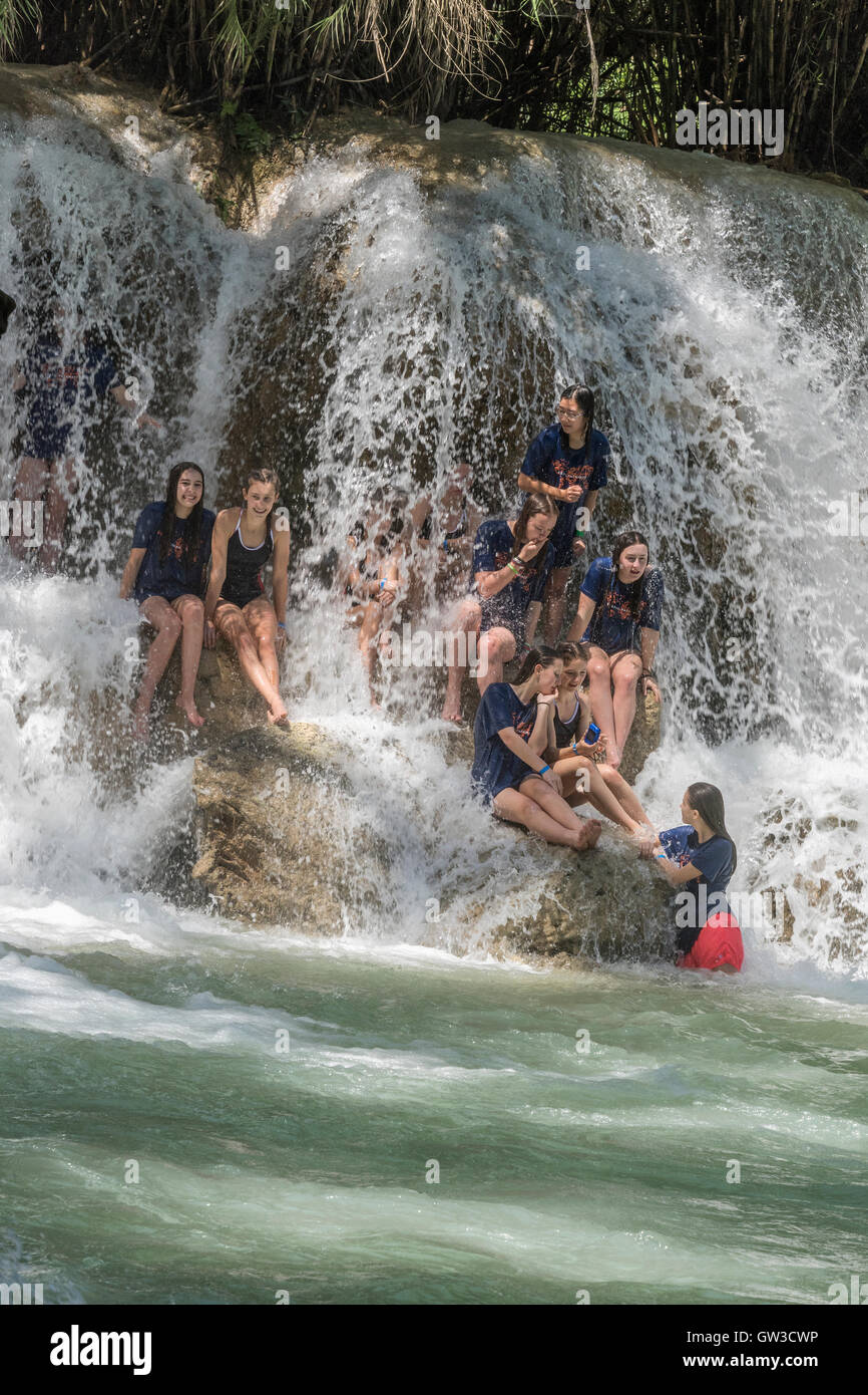 Girls enjoying the Kuang Xi falls, southwest of Luang Prabang, Laos ...