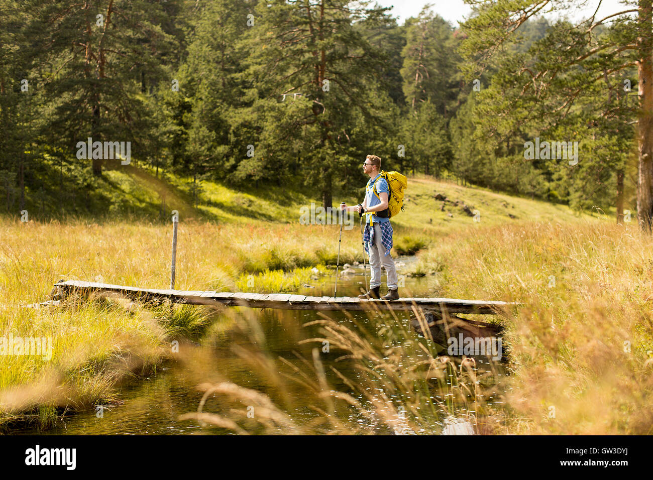 Young man crosses mountain hi-res stock photography and images - Alamy