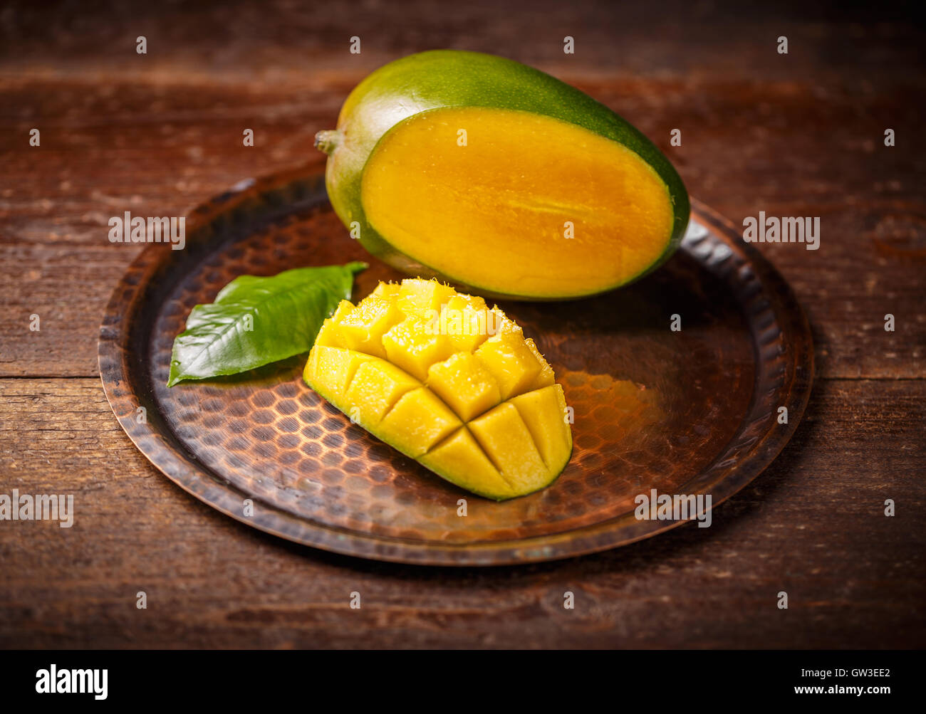 Fresh mango organic product on rustic background Stock Photo - Alamy