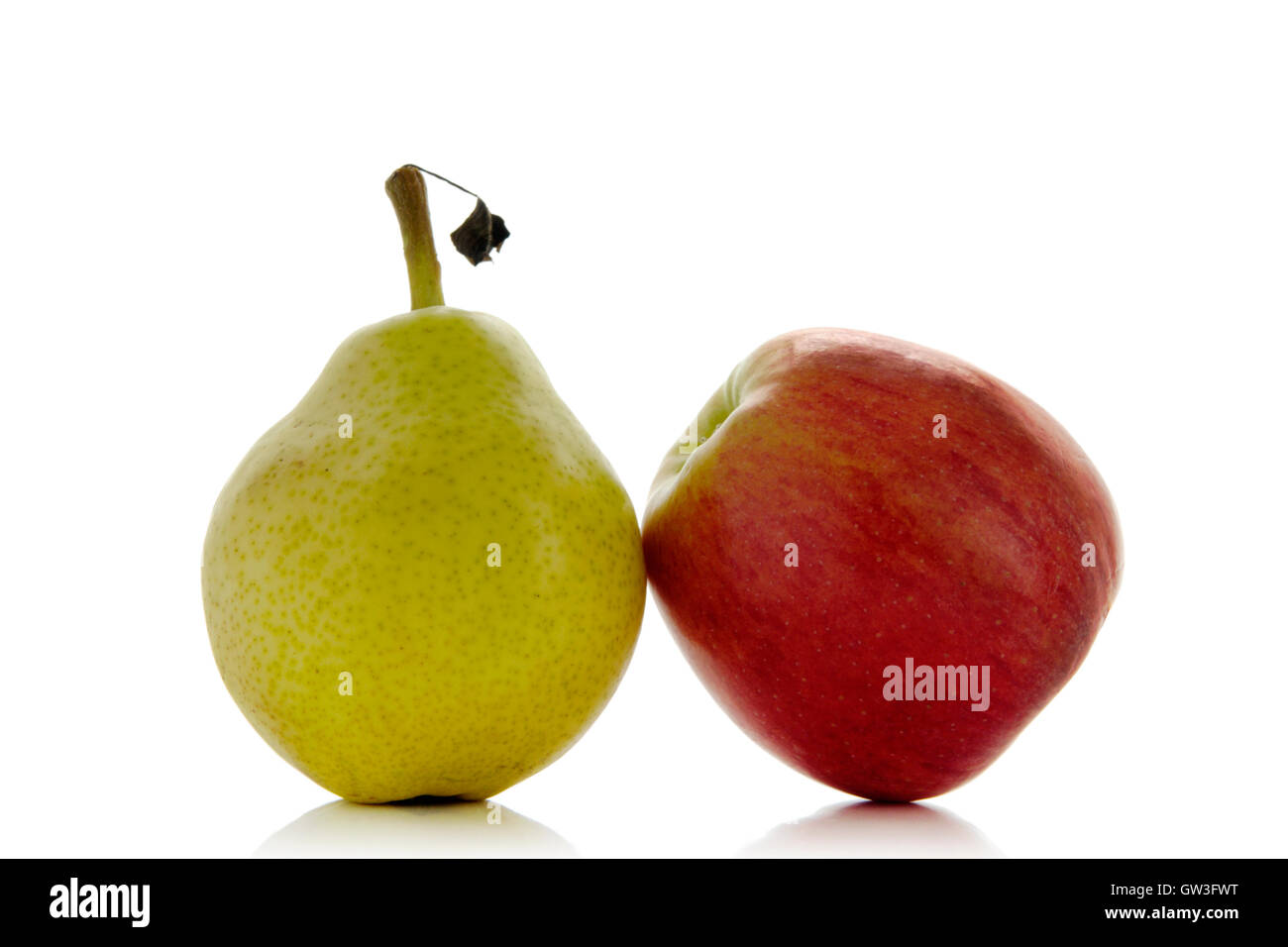 green pear and red apple over white background Stock Photo - Alamy