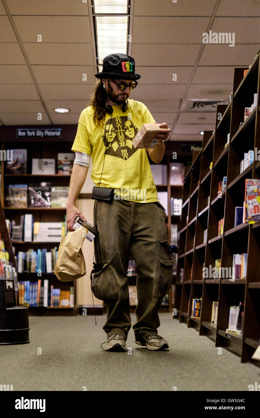 Checking out a book hi-res stock photography and images - Alamy