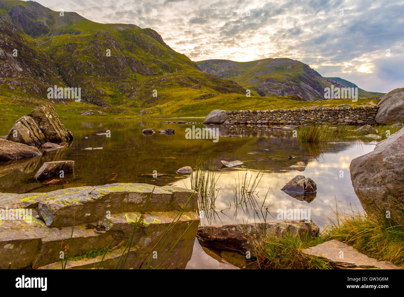 Llyn Idwal lake SNowdonia National Park Wales lies within Cwm Idwal in ...