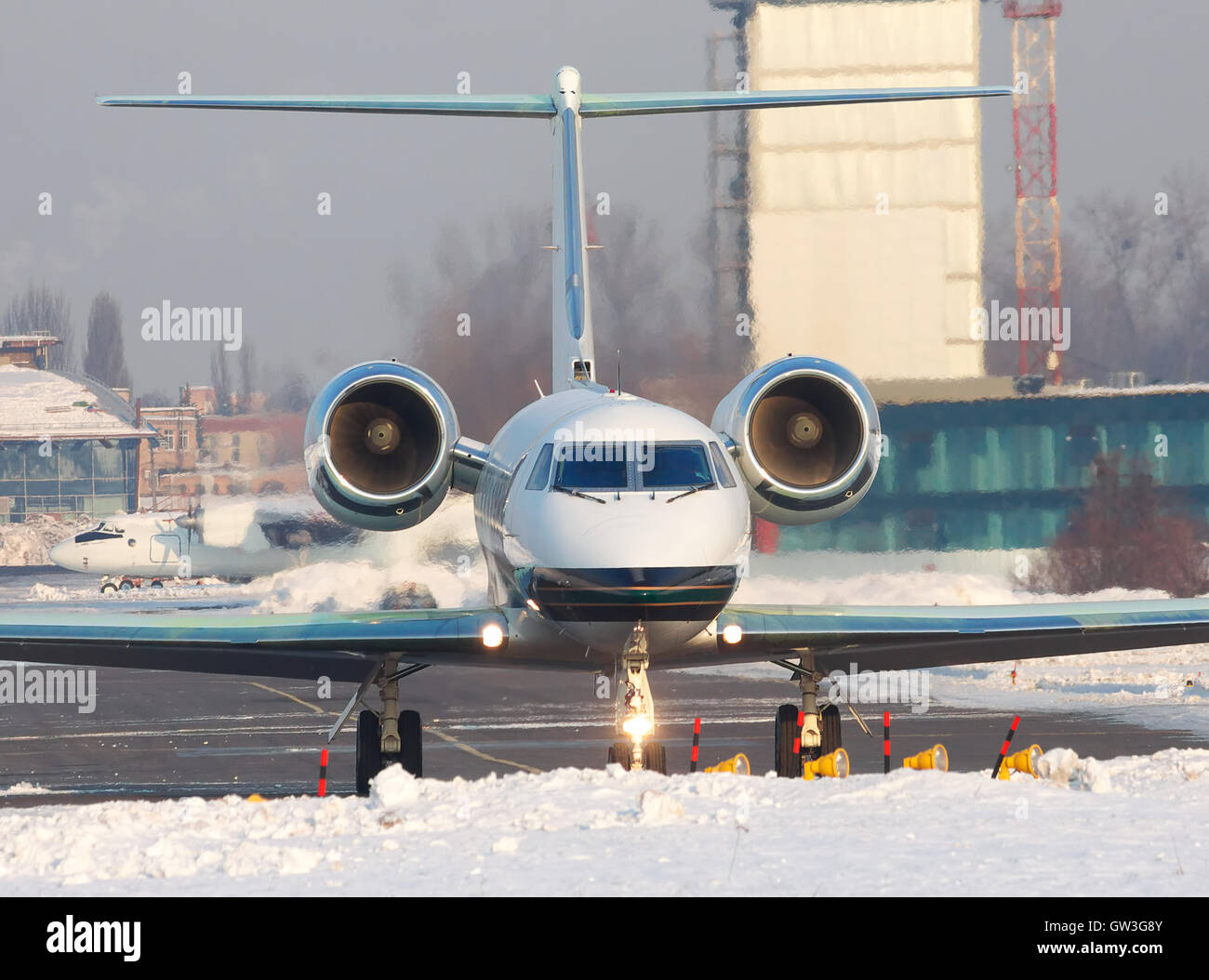 Business jet taxiing to the runway in winter Stock Photo - Alamy